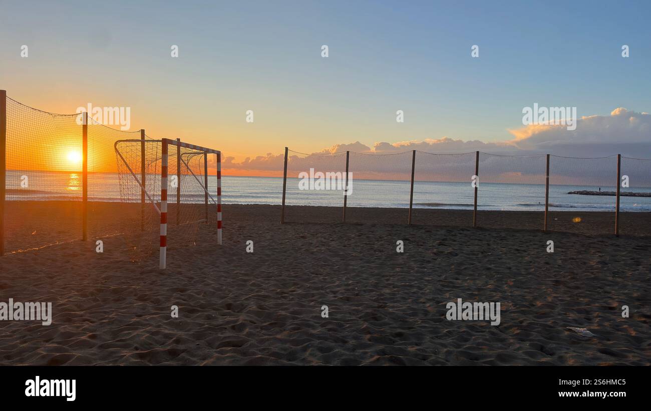 Football pitch in the sand at the beach during sunrise Stock Photo - Alamy