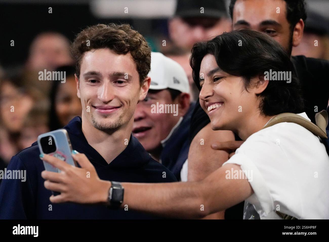 Ugo Humbert of France poses for a photo with fans following his third ...
