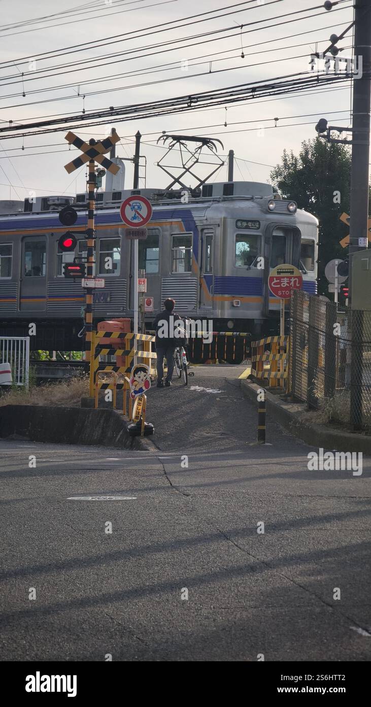 Lady crossing railway line hi-res stock photography and images - Alamy