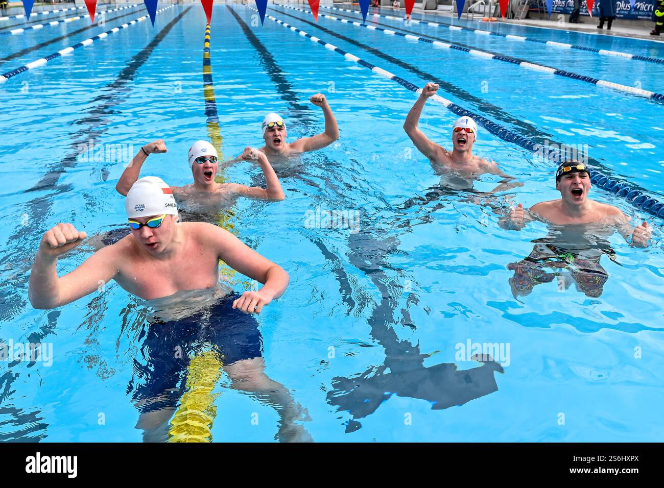 Athletes of team Poland react after competing in the 100m Freestyle Men ...