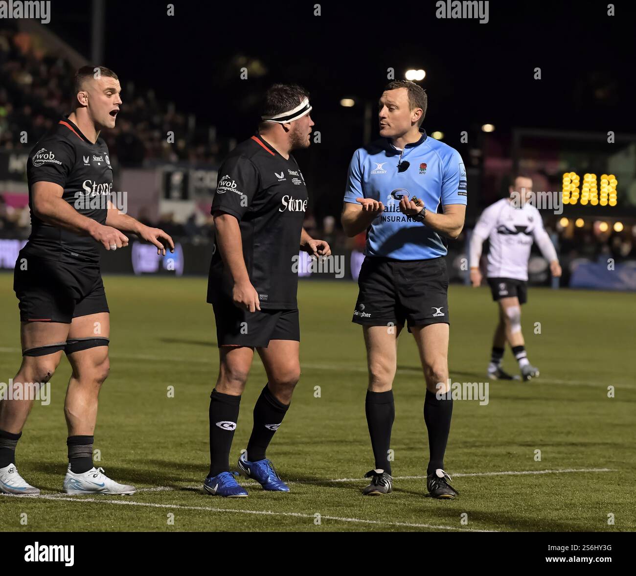 Matthew Carley Referee and Jamie George of Saracens during the ...