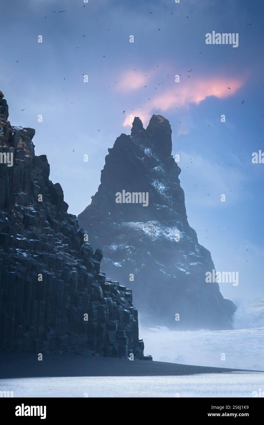 View of the basaltic columns and Reynisdrangar at Reynisfjara beach ...