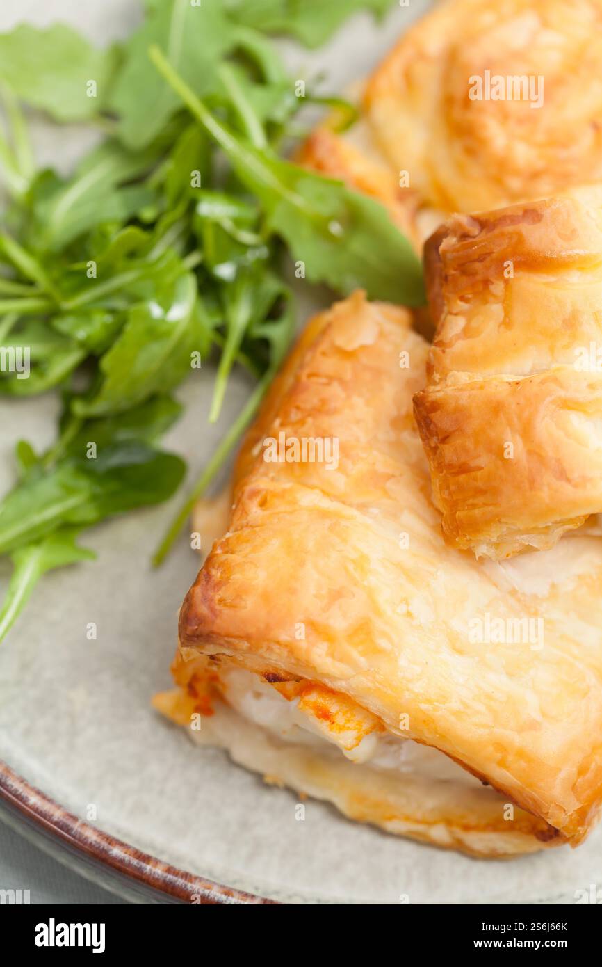 Baked cod in puff pastry Stock Photo - Alamy