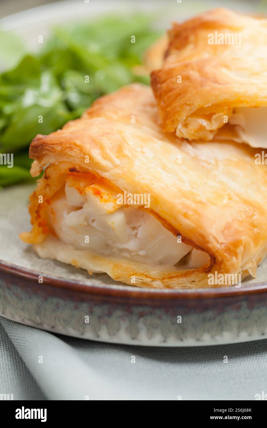 Baked cod in puff pastry Stock Photo - Alamy