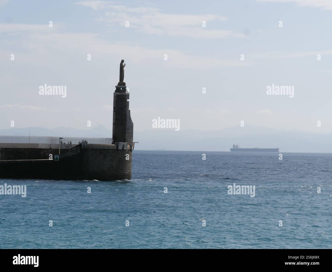 A huge Jesus statue greets the ships in Tarifa Spain Stock Photo - Alamy