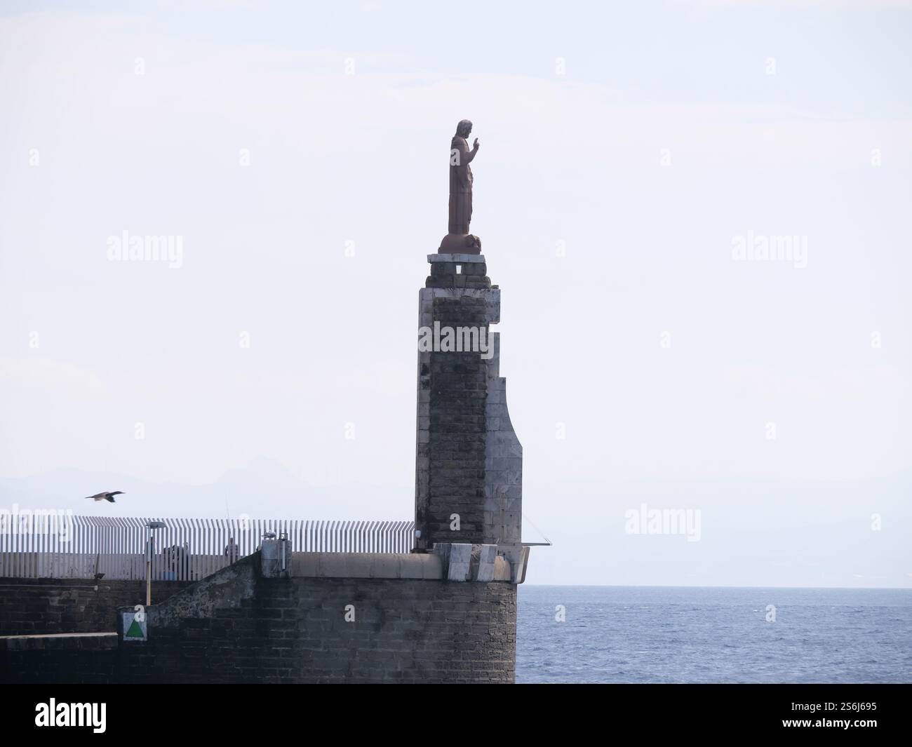 A huge Jesus statue greets the ships in Tarifa Spain Stock Photo - Alamy