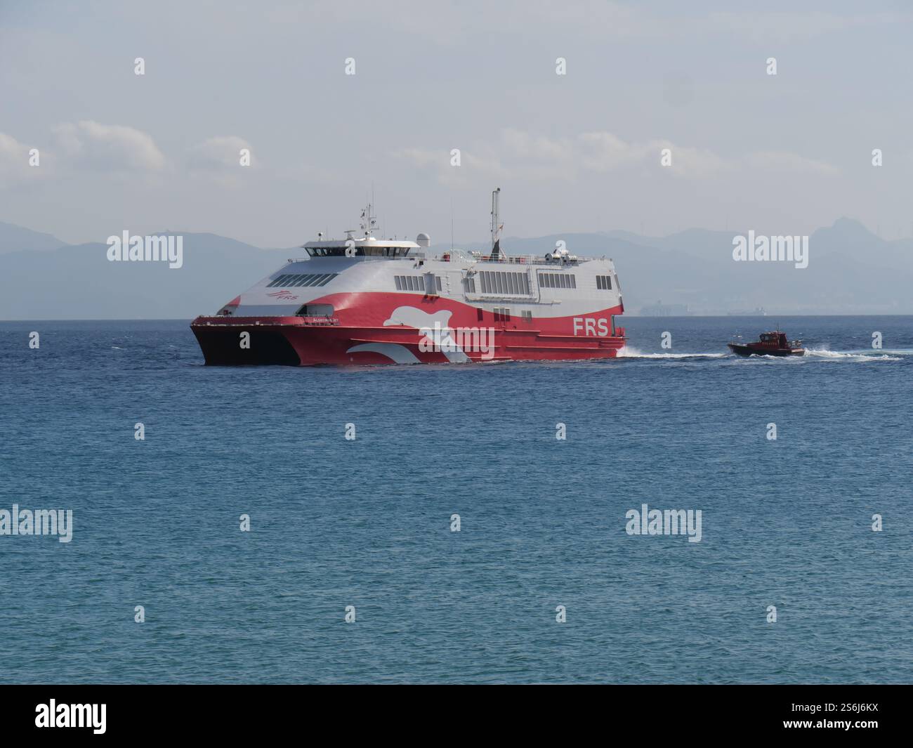 A red white ferry arrives from Africa at the port of Tarifa Spain Stock ...