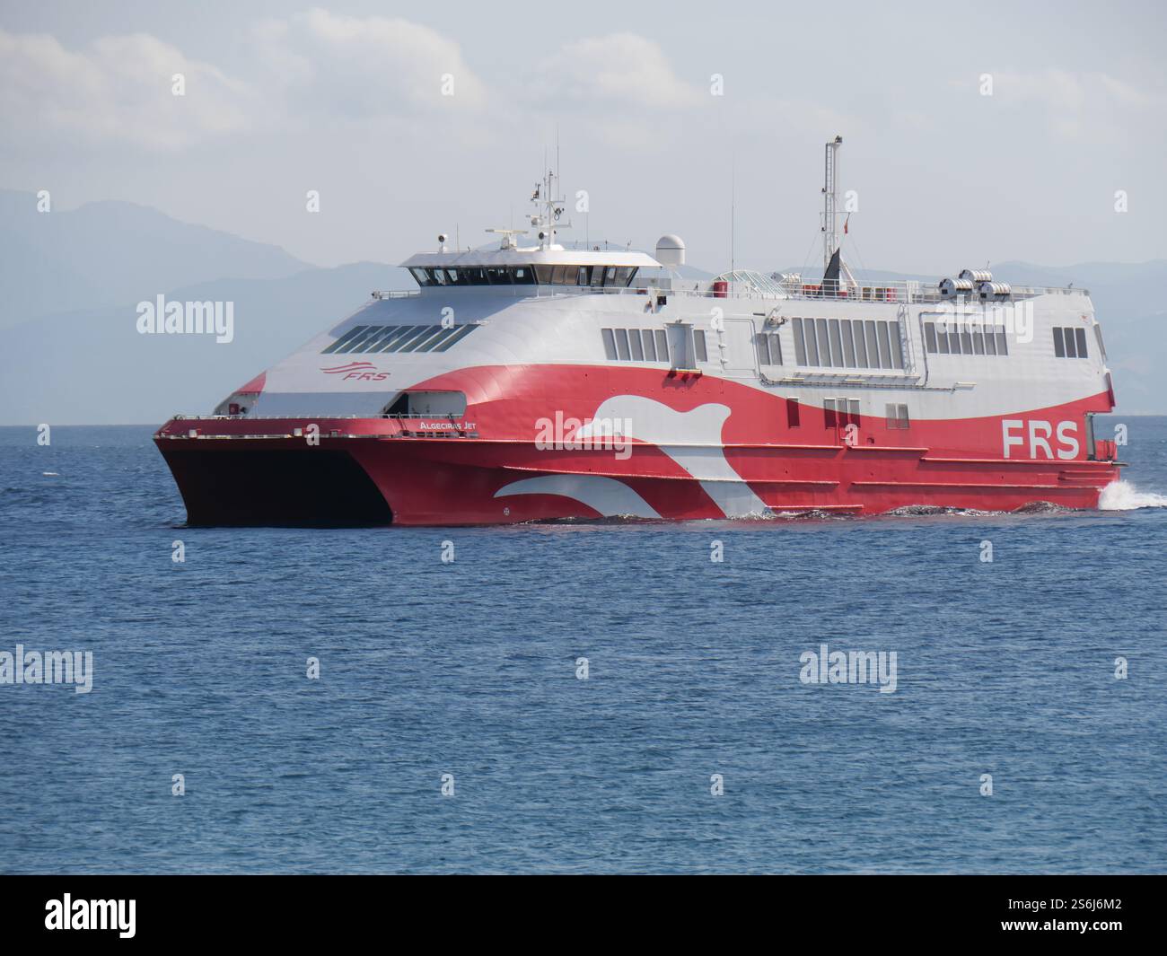 A red white ferry arrives from Africa at the port of Tarifa Spain Stock ...