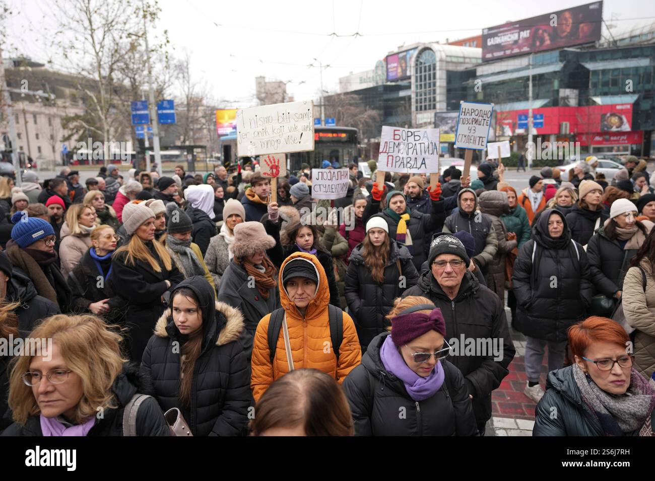 People stopping traffic stand in silence to commemorate the 15 victims ...