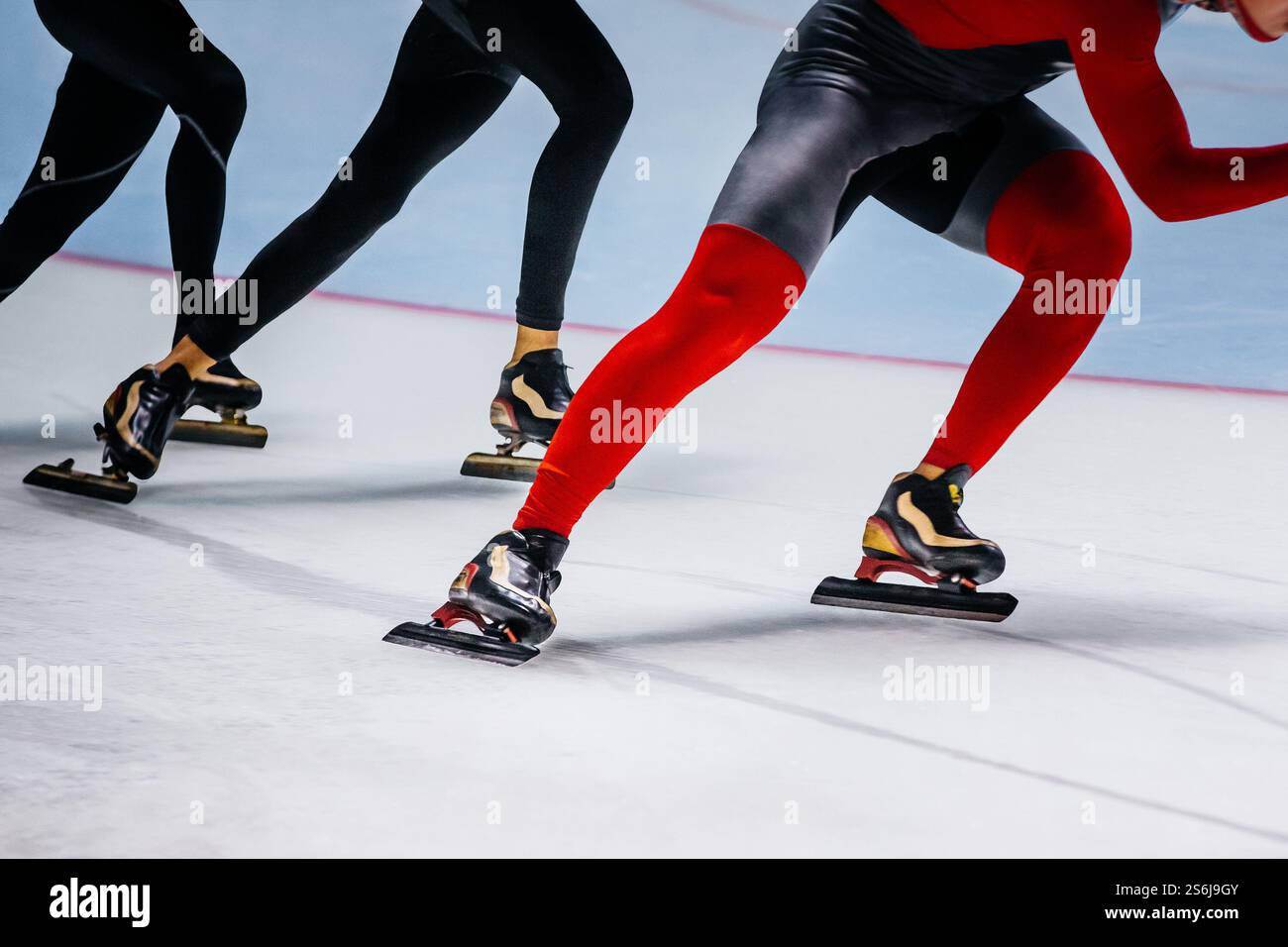 legs three man skaters at speed skating competition Stock Photo - Alamy