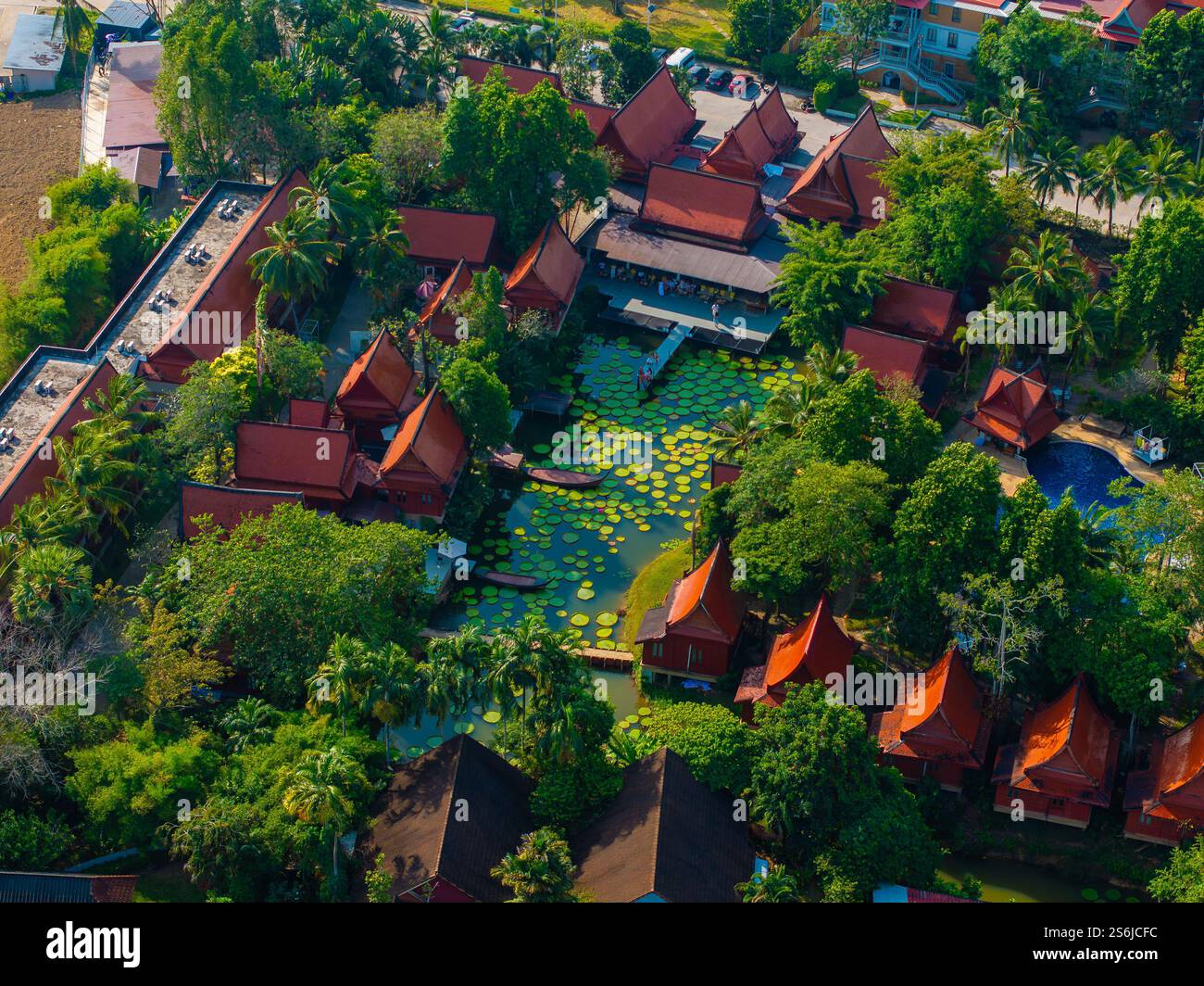 Aerial view of red roofed Thai buildings with pointed gables ...