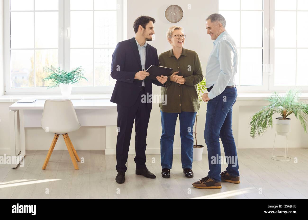Elderly Couple Viewing Home With Real Estate Agent Stock Photo - Alamy