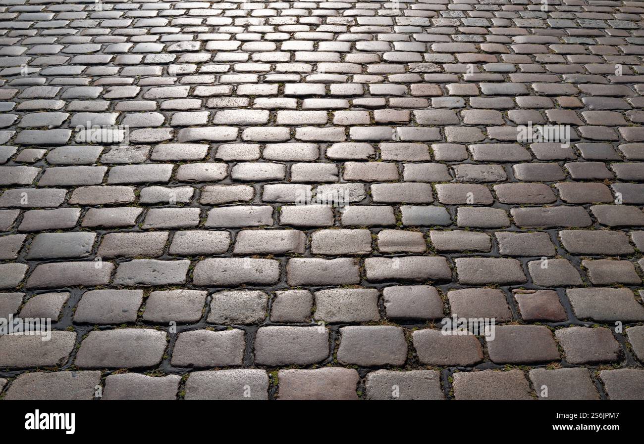 Pavement road. Background of bricks road. Stone cladding pavement ...