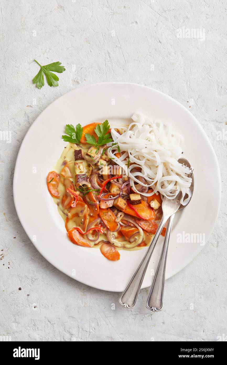 Carrot and Coconut Curry with Noodles Stock Photo - Alamy