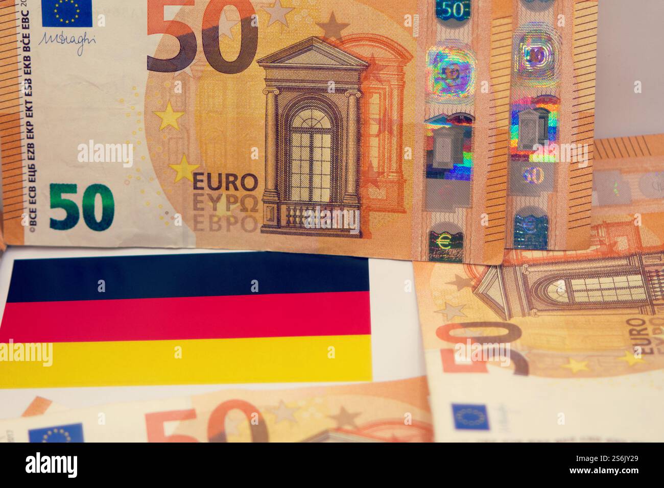 Germany flag with european banknotes Stock Photo - Alamy