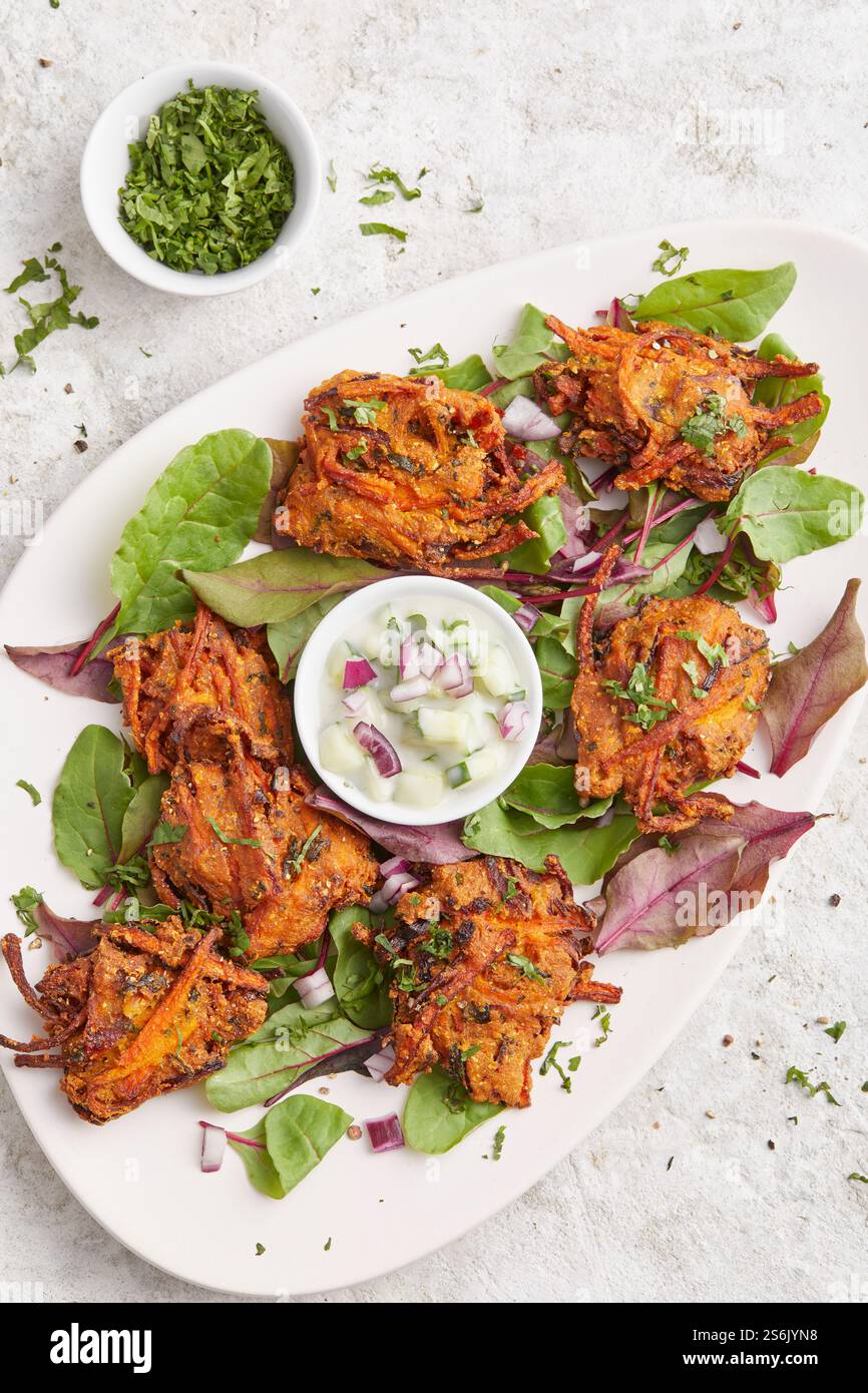 Carrot and Onion Pakoras with Raita Stock Photo - Alamy