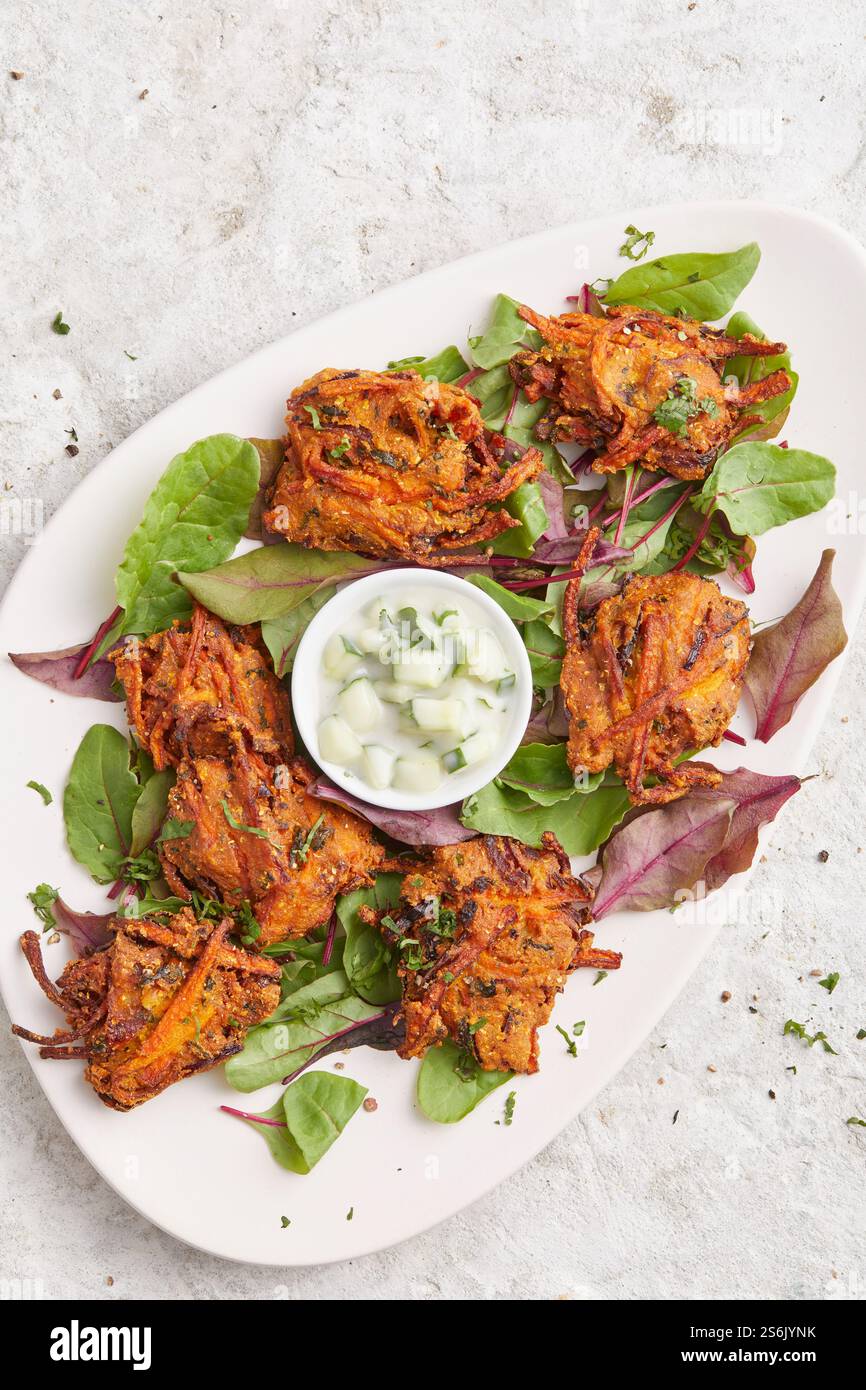 Carrot and Onion Pakoras with Raita Stock Photo - Alamy