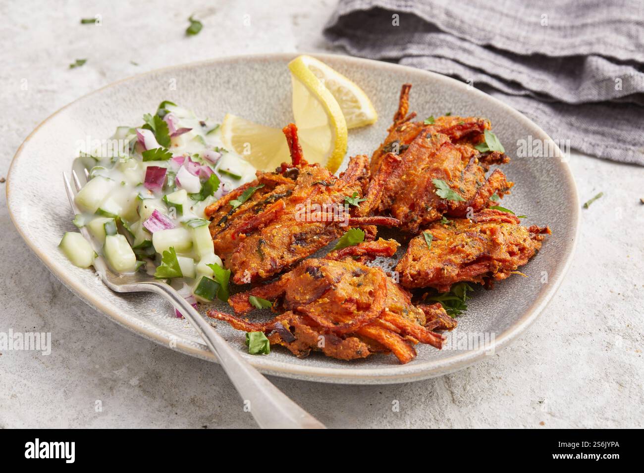 Carrot and Onion Pakoras with Raita Stock Photo - Alamy