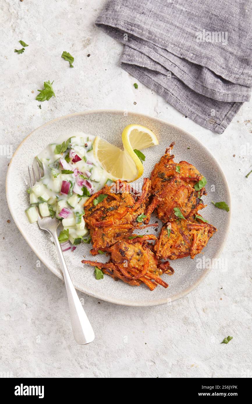 Carrot and Onion Pakoras with Raita Stock Photo - Alamy