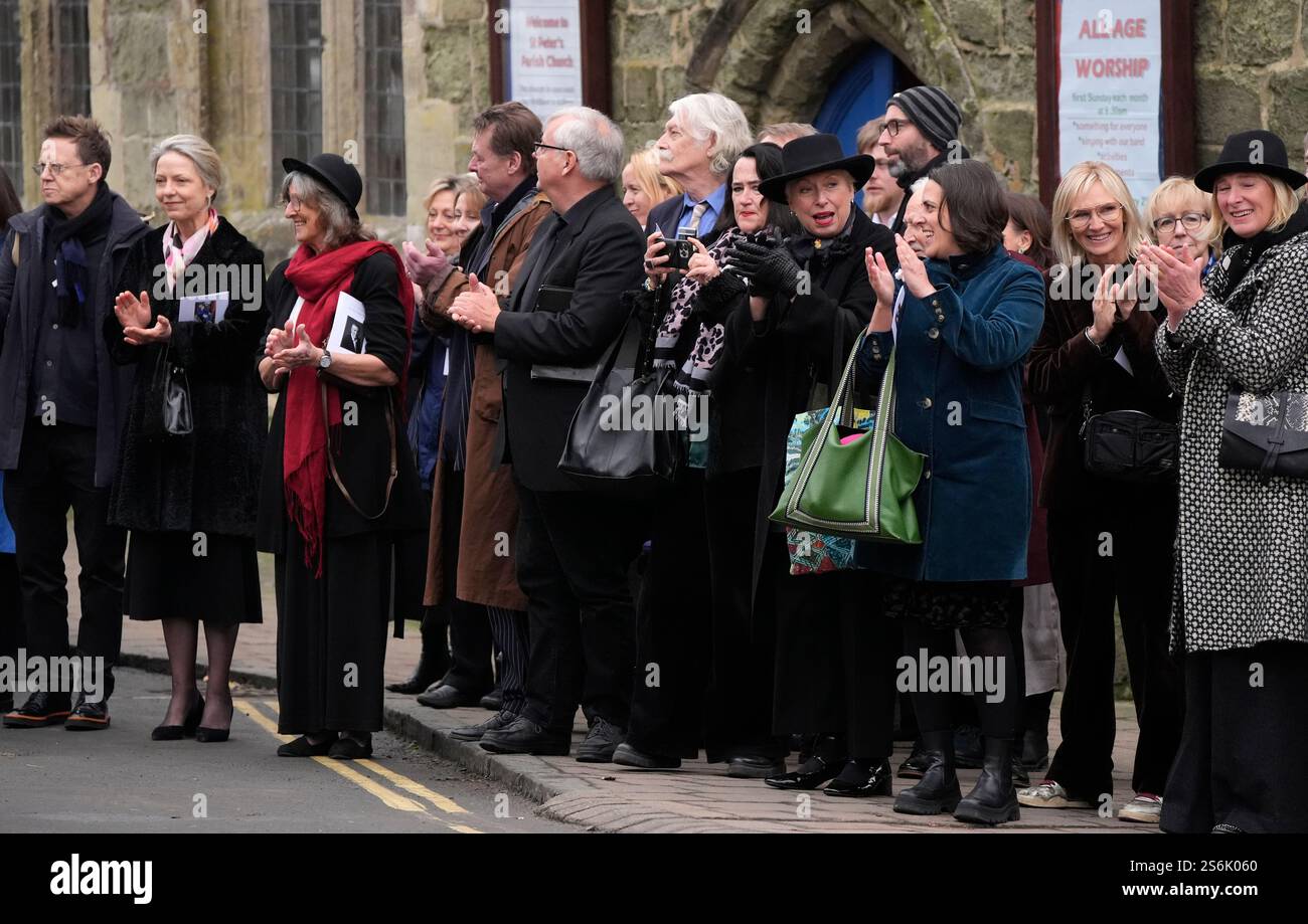 People clap in tribute as the hearse leaves following the funeral of DJ ...