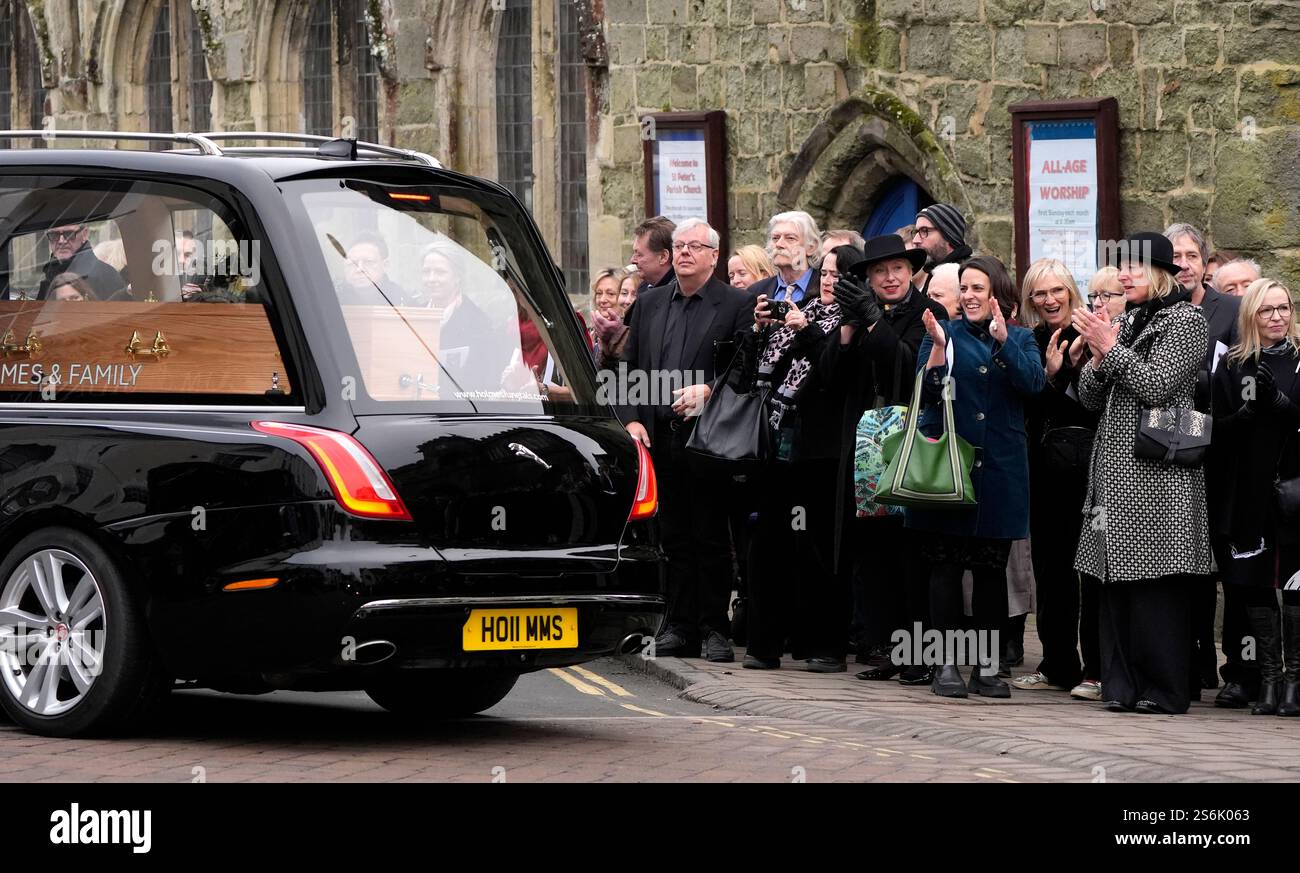 People clap in tribute as the hearse leaves following the funeral of DJ ...