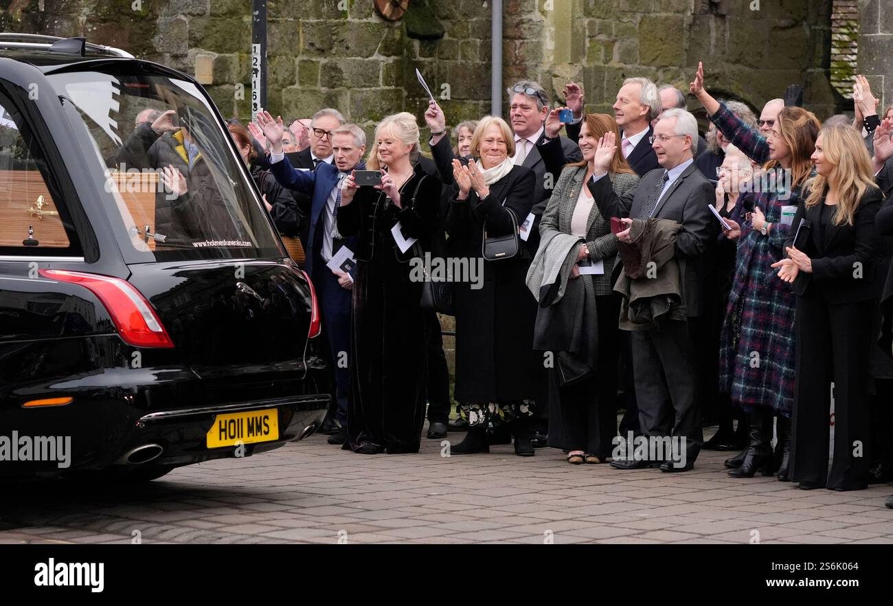 People clap in tribute as the hearse leaves following the funeral of DJ ...