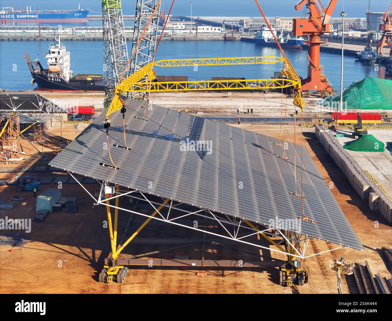 A large steel truss offshore photovoltaic platform is transferred to ...