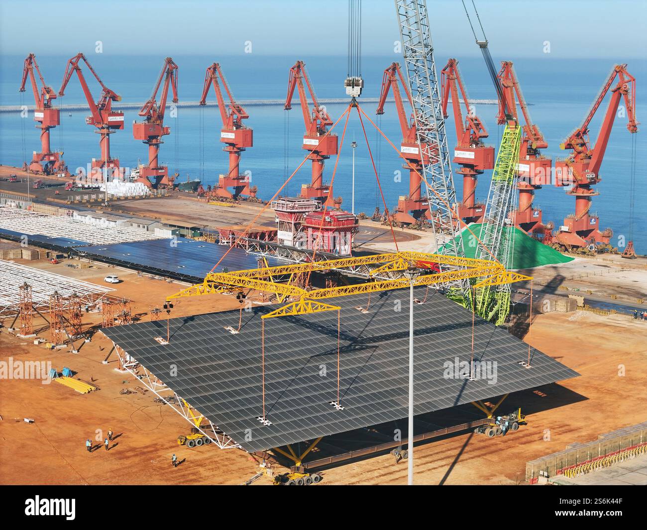 A large steel truss offshore photovoltaic platform is transferred to ...