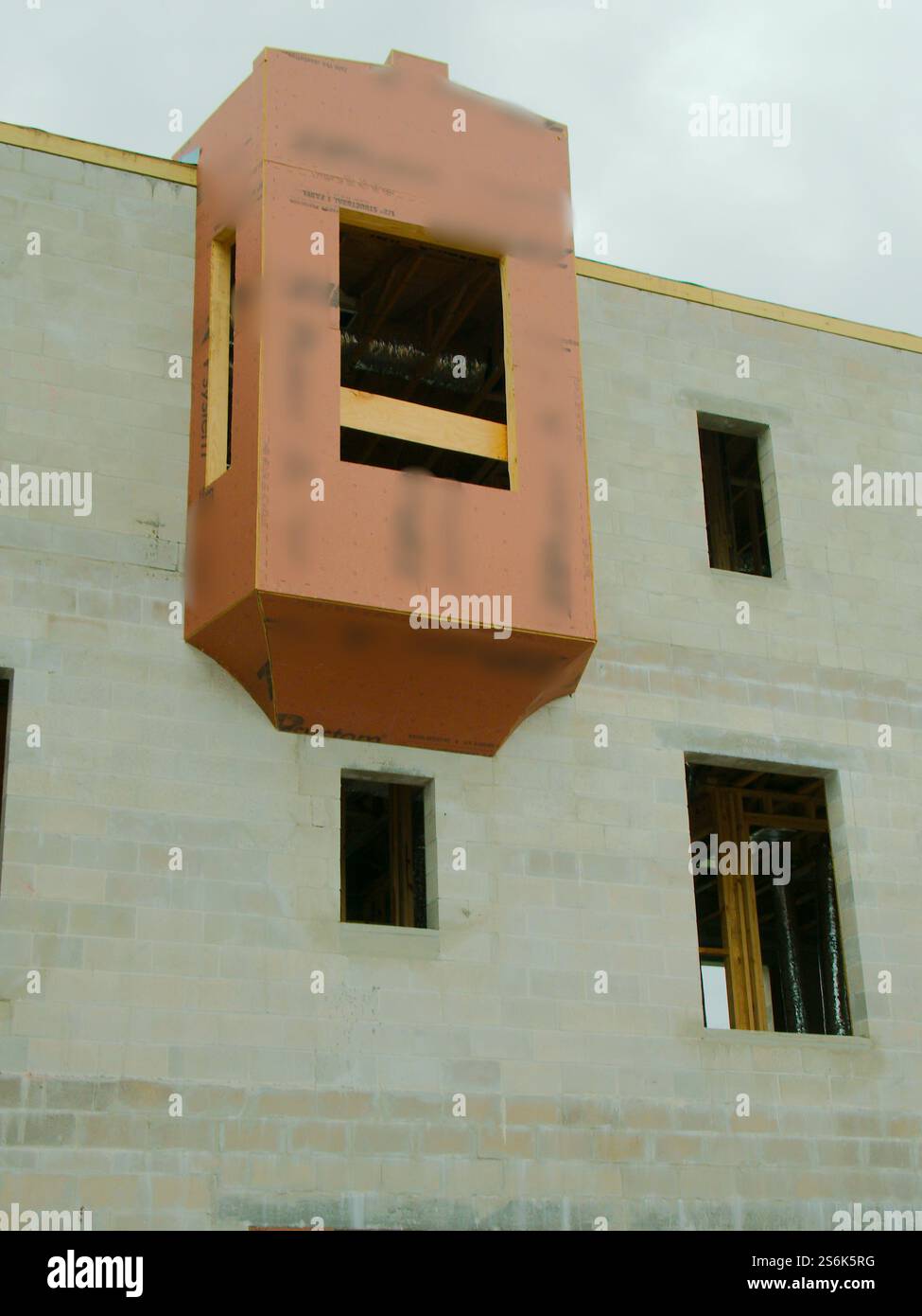 Three story concrete block house under construction. Unfinished block ...