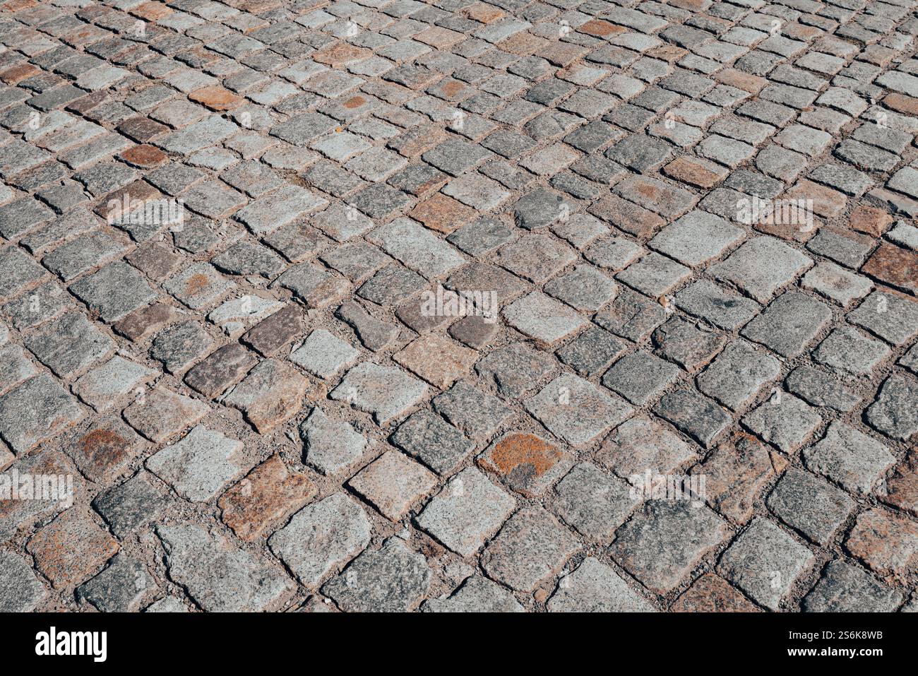 Background of bricks road. Background with bricks road. Stone cladding ...
