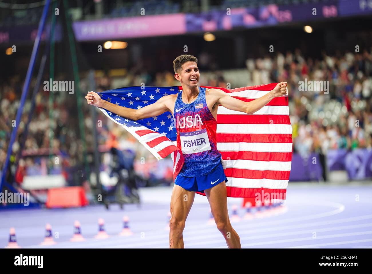 Grant Fisher celebrating her medal with her country's flag at the Paris ...
