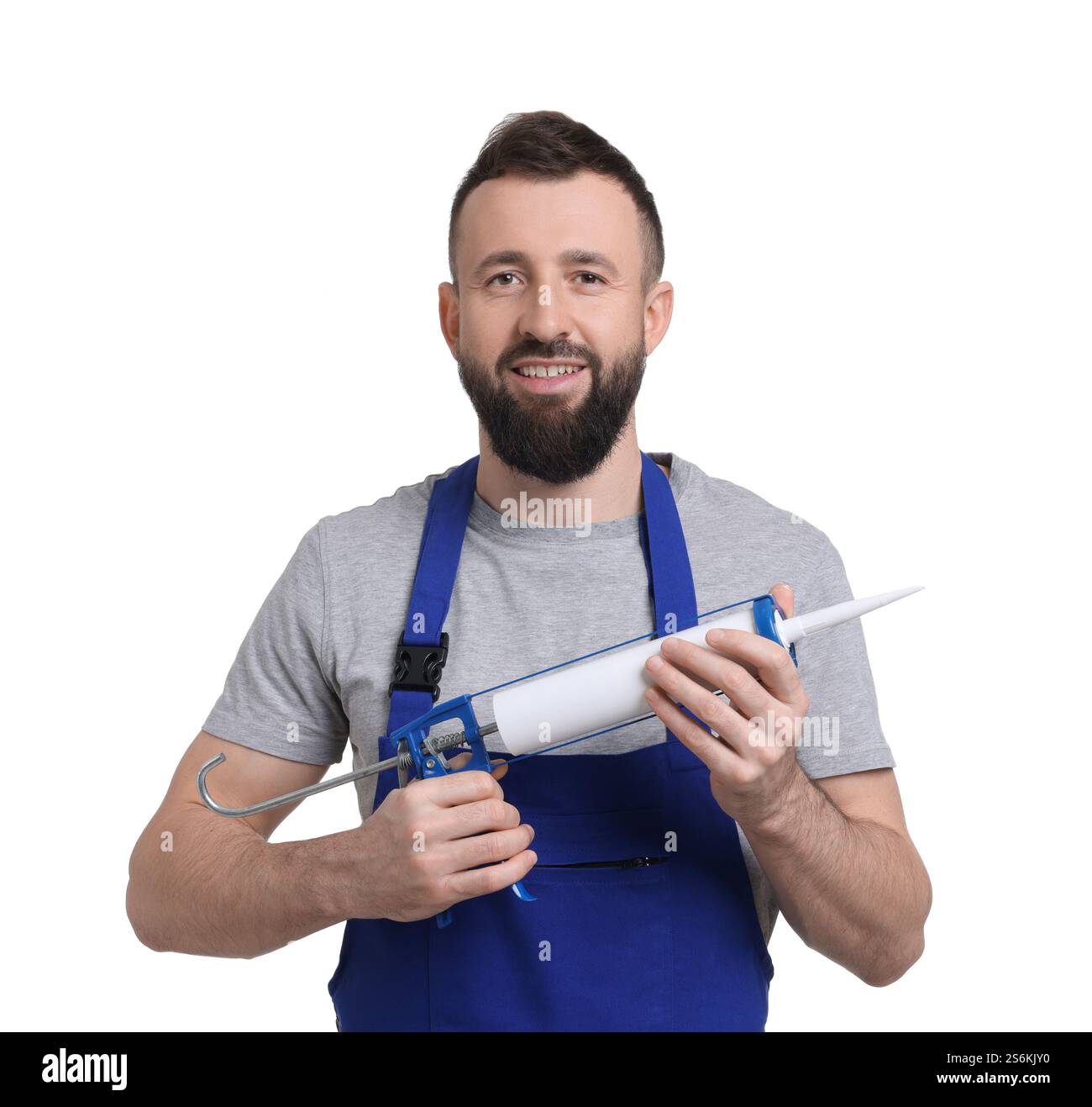 Worker with caulking gun on white background Stock Photo - Alamy