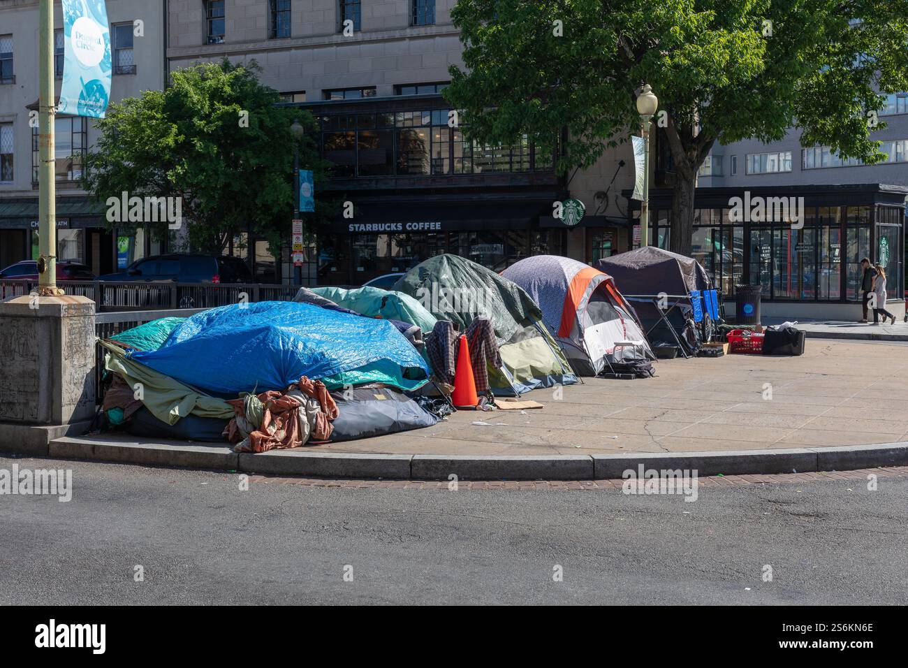 Homeless encampment on the sidewalk with tents at a row at Dupont ...