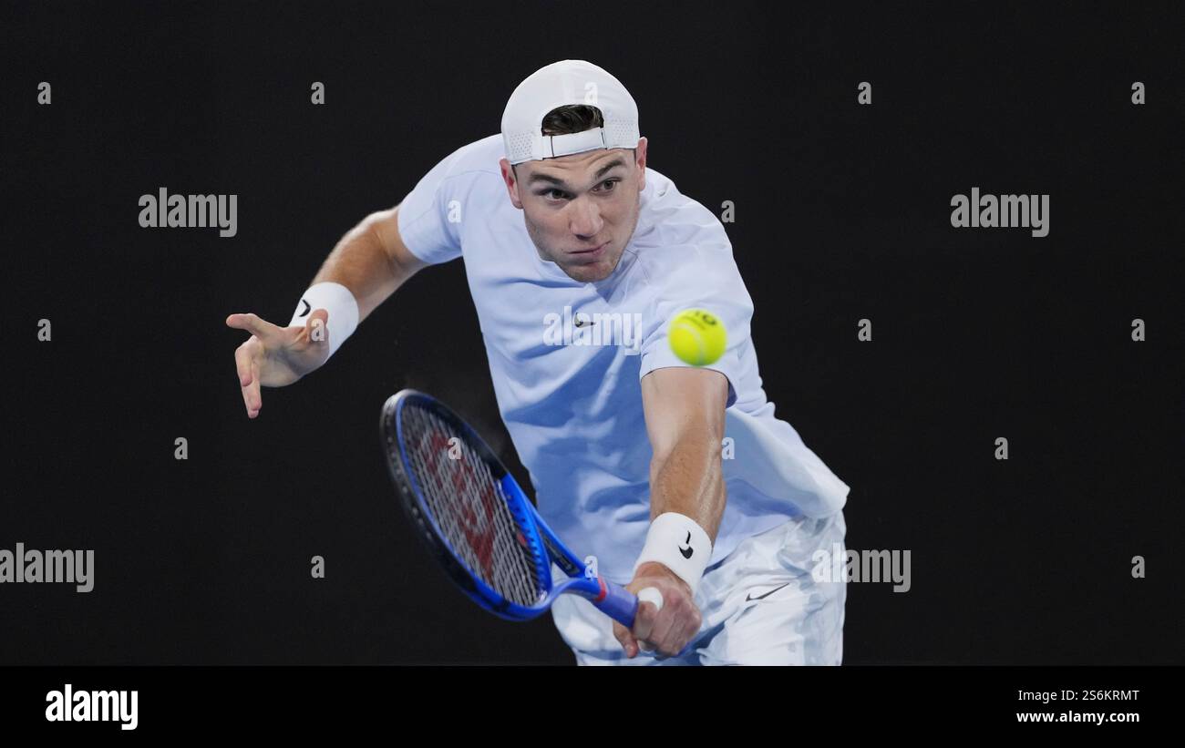 Jack Draper of Britain returns a shot to Aleksandar Vukic of Australia ...