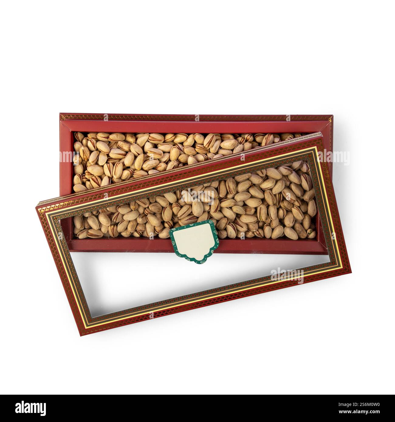 Top view of an elegant red gift box filled with pistachios, featuring a ...