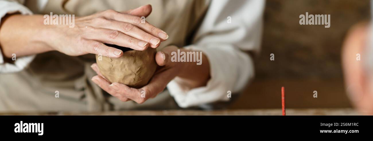 woman spends quality time in a pottery class, shaping clay with care ...