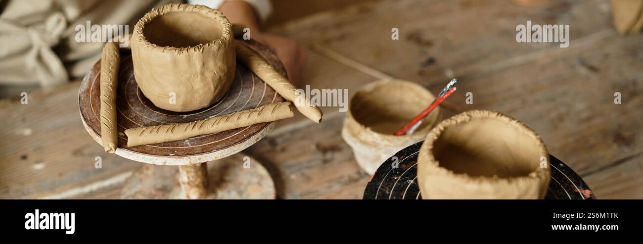 shaped clay in a pottery class, enjoying meaningful moments, banner ...