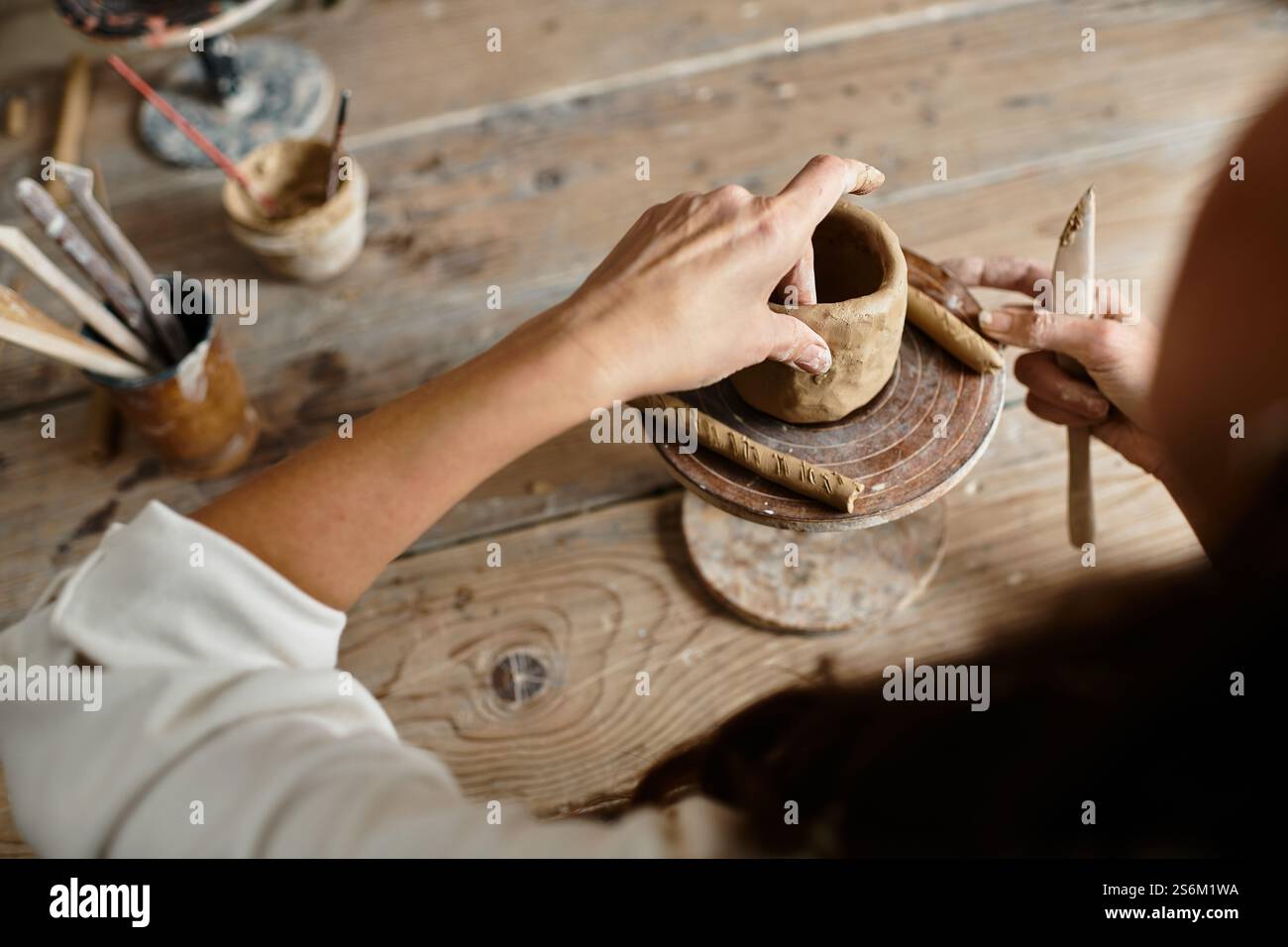 Mature woman sculpting clay into beautiful creations Stock Photo - Alamy