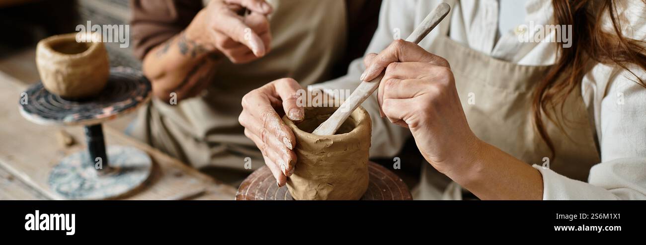 Mature couple shares a joyful moment in pottery class, crafting unique ...