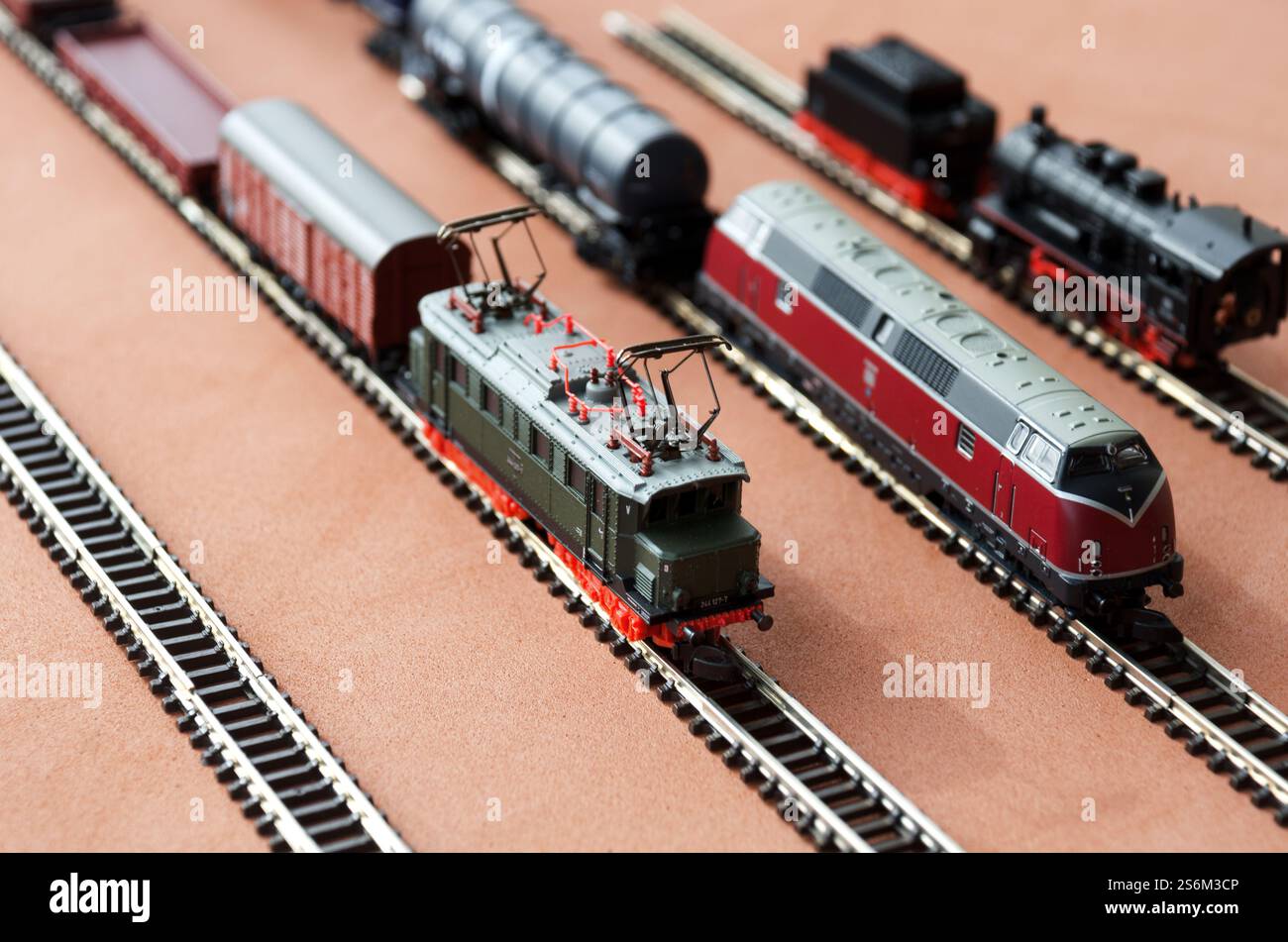 Toy passenger train and railroad with selective focus effect. Model of ...