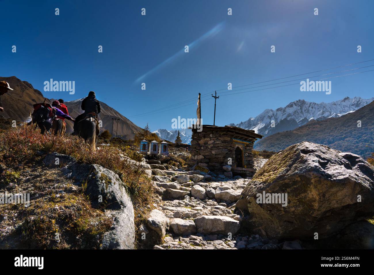 Langtang Village - October 16 2024 : Trekkers riding horses before reaching Kyanjin Gompa ...