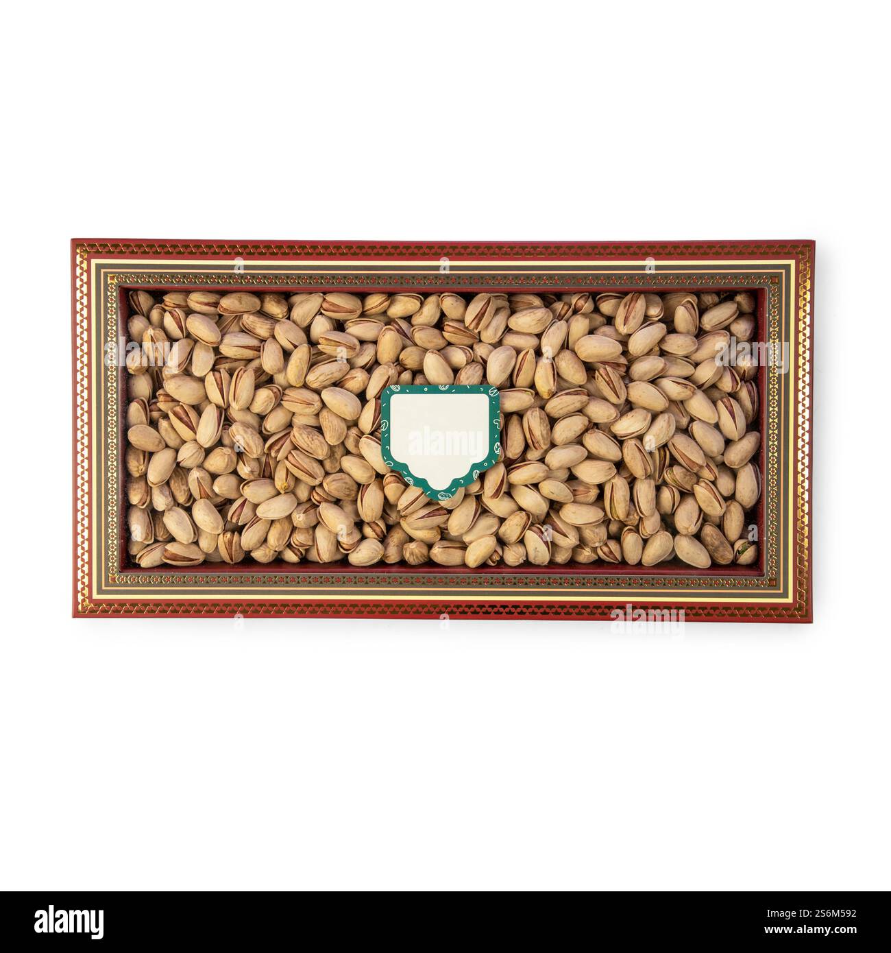 Top view of a red luxury nut box with pistachios and a clear lid on ...