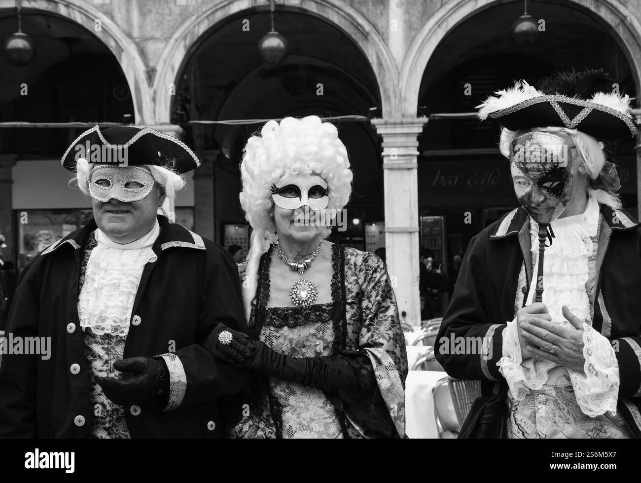 VENICE, ITALY - FEBRUARY 14, 2015:Three seniors in masks at St Mark's ...
