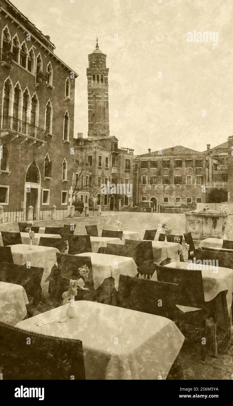 Empty romantic cafe terrace at square in Venice, Italy. Flowers on ...