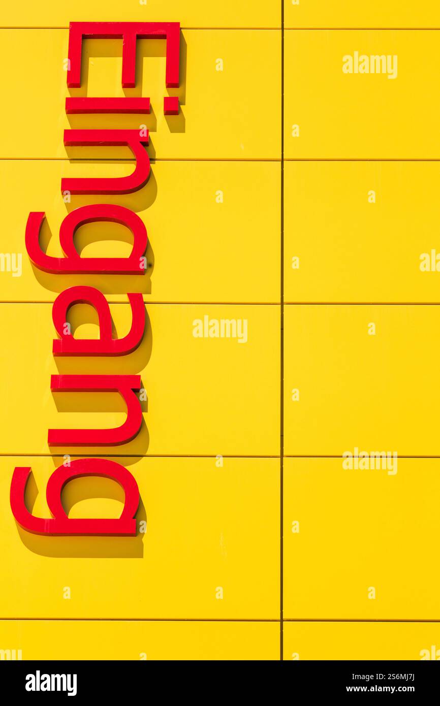 Large red letters with the words - EINGANG - on a yellow background ...
