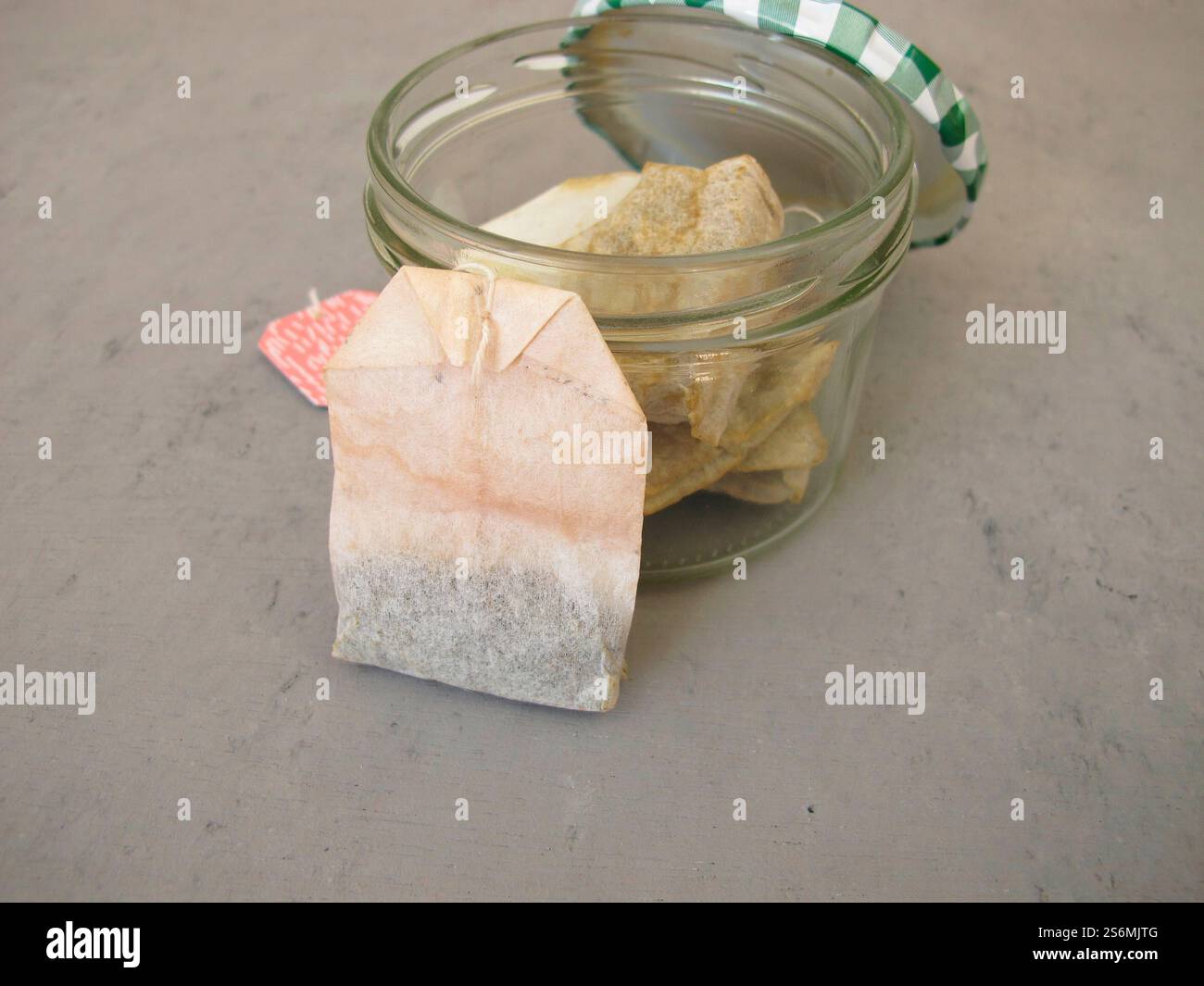 Used dried tea bags in a jar for homemade plant fertilizer for ...