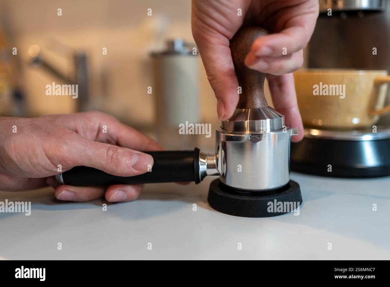 Barista tamping freshly ground coffee hi-res stock photography and ...