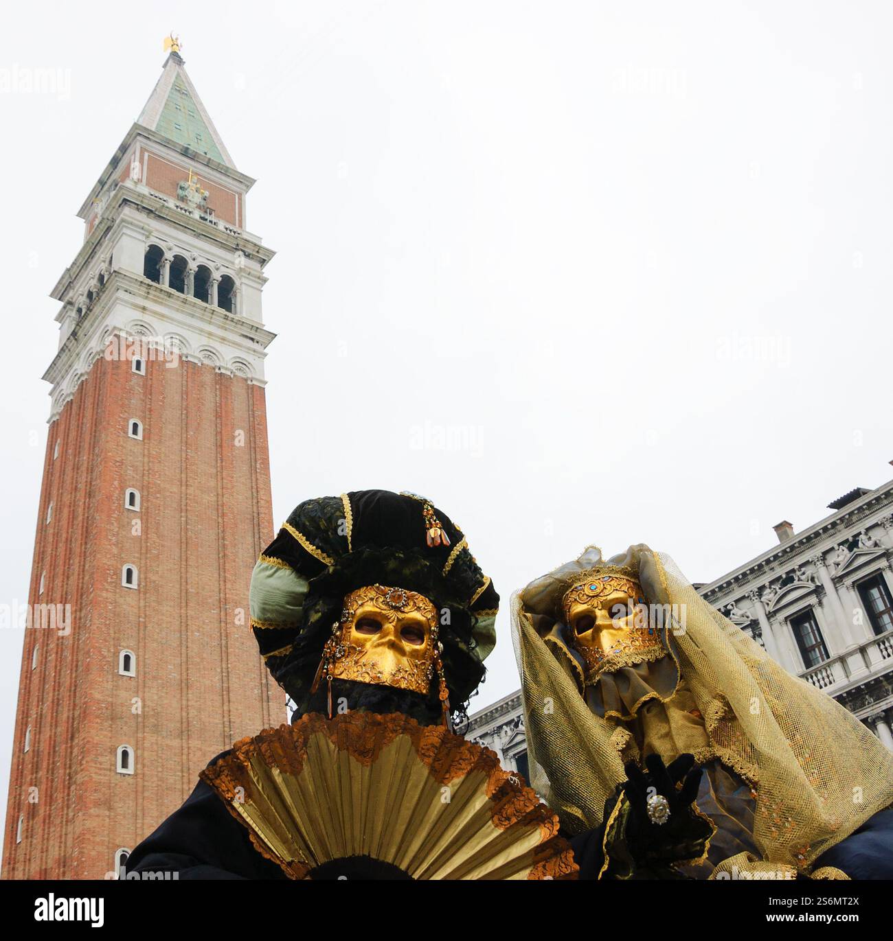 Two golden spooky masks in St Mark's Square square during the ...