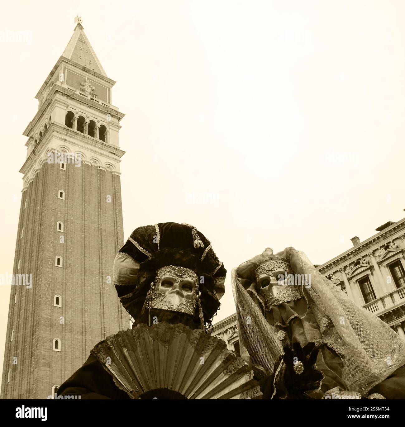 Two spooky masks in St Mark's Square square during traditional Carnival ...