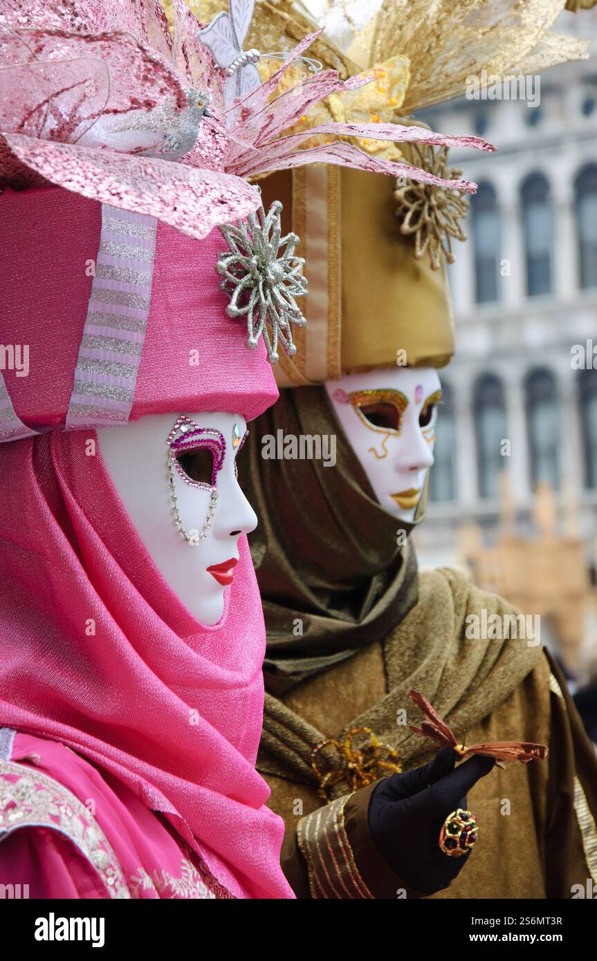 Portrait of noble couple masks in costumes decorated with flowers ...